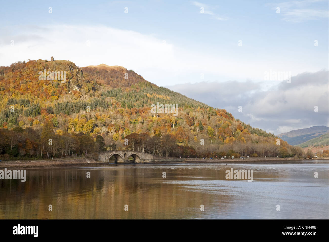 View coastline bridge wooded hill at edge sea loch Dun Corr Bhile ...