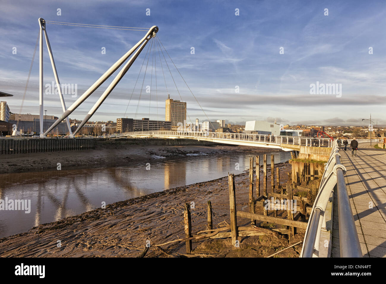 View of tidal river and footbridge, Newport City Footbridge, River Usk ...