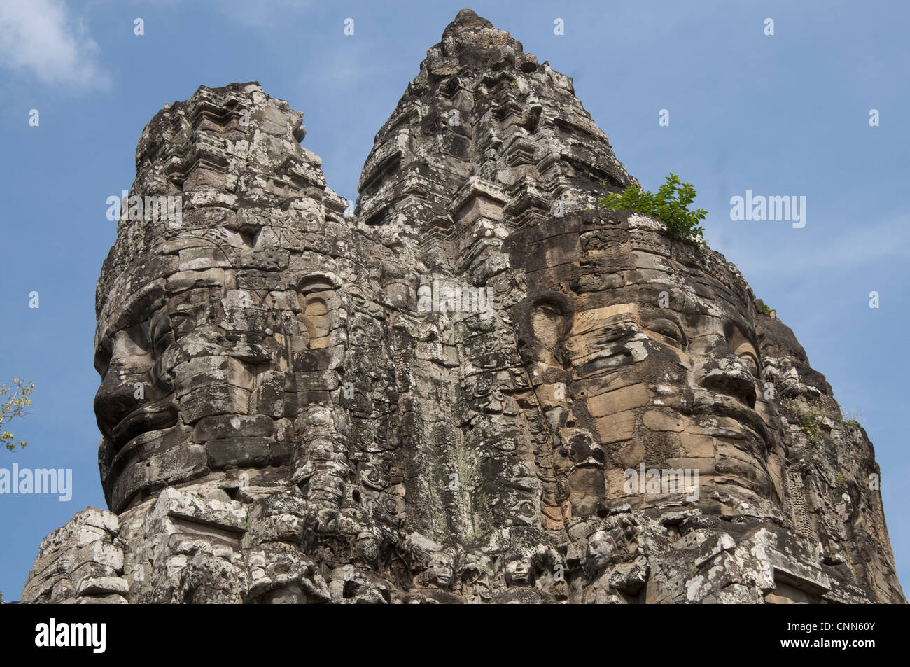 Top of major gate tower with large sculptures of heads, at Khmer temple ...