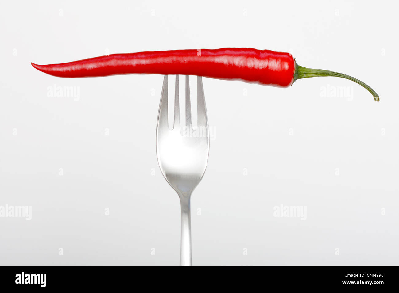 Red hot chili on a fork Stock Photo - Alamy