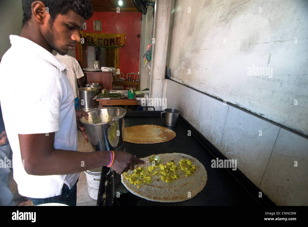 Masala Dosa preparation in a small hole in the wall restaurant in Kandy ...