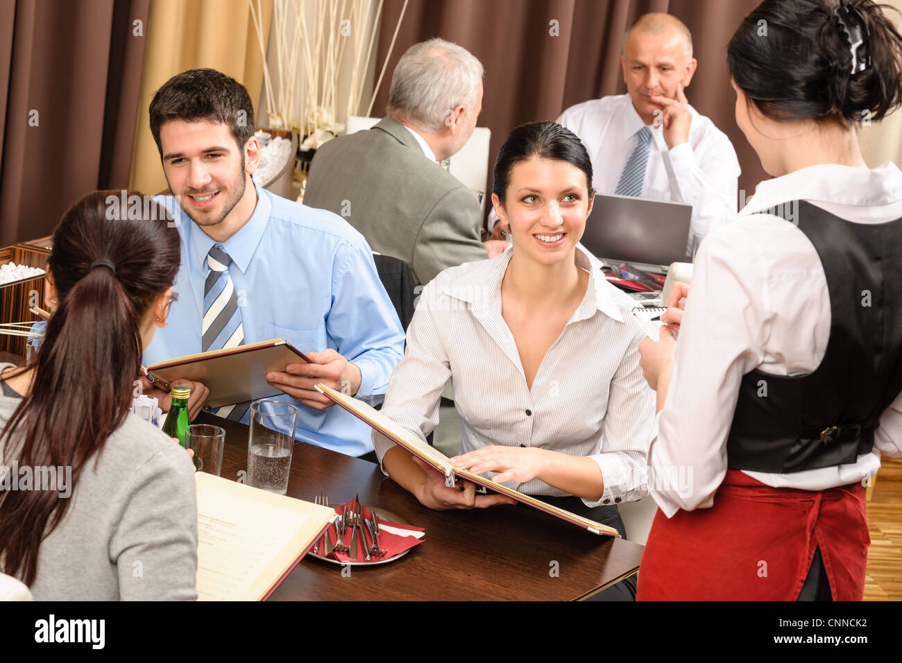 Business lunch executive people looking menu waitress taking order ...