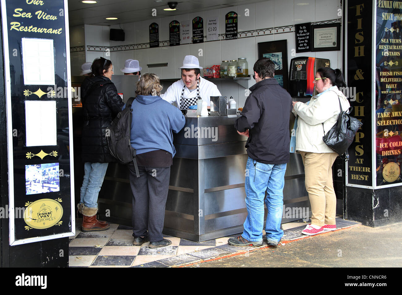 Fish and chips fast food service counter Stock Photo - Alamy