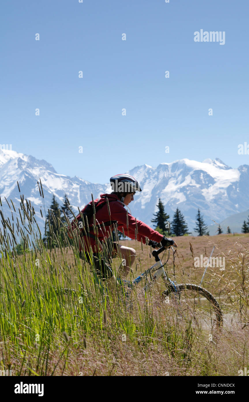 Boy Riding Bicycle in Mountains, Alps, France Stock Photo - Alamy