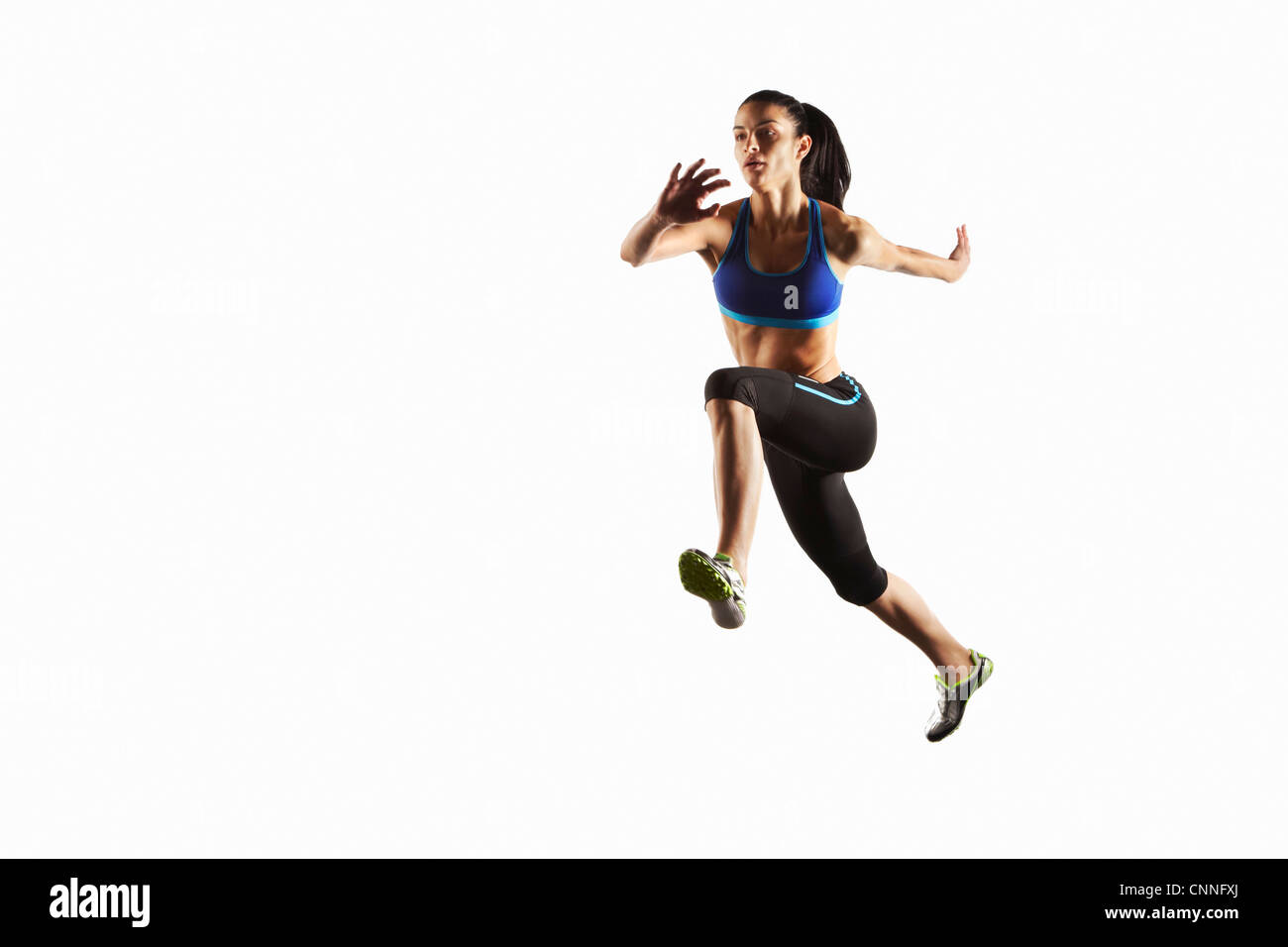 Woman in field running Cut Out Stock Images & Pictures - Alamy