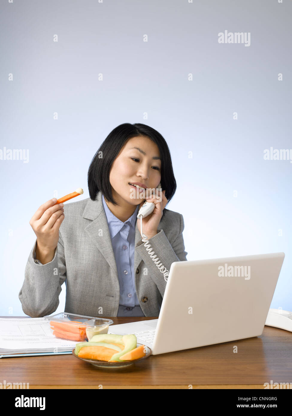Japanese eating at desk hi-res stock photography and images - Alamy