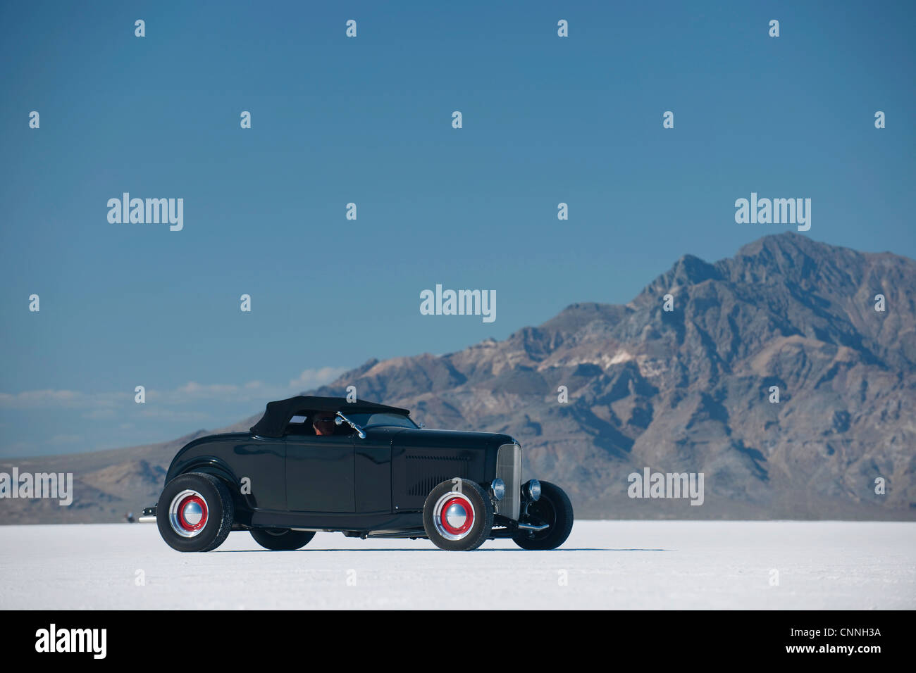 Bonneville Salt Flats bike week retro 1950s car racing in USA, car parked on hot white salt ...