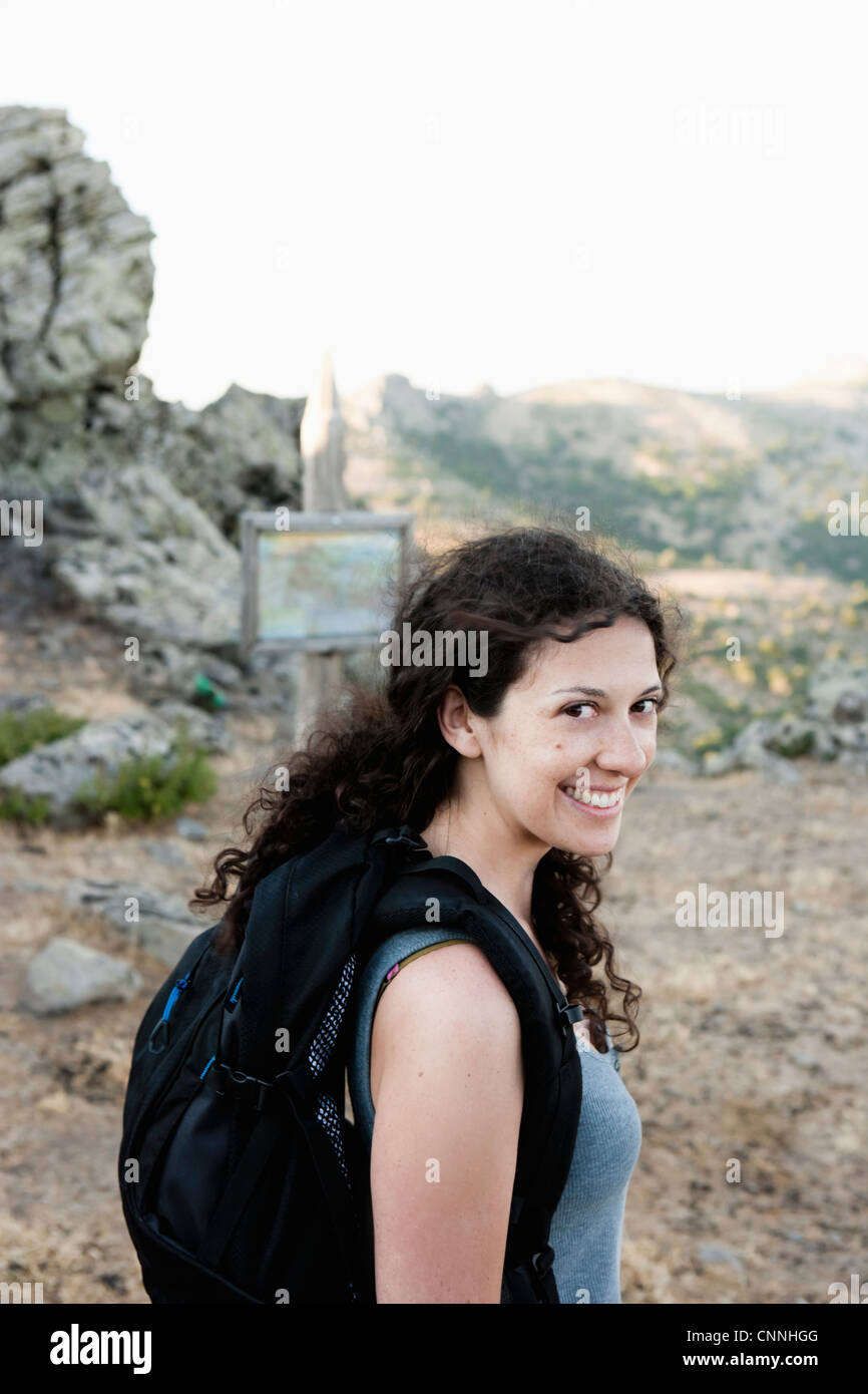 Smiling woman hiking on path Stock Photo - Alamy