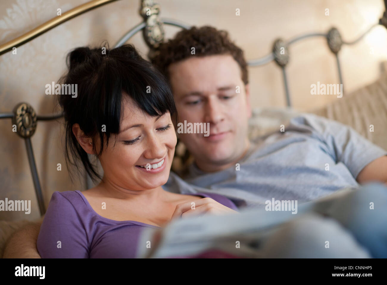 Heterosexual couple cuddling bed hi-res stock photography and images ...