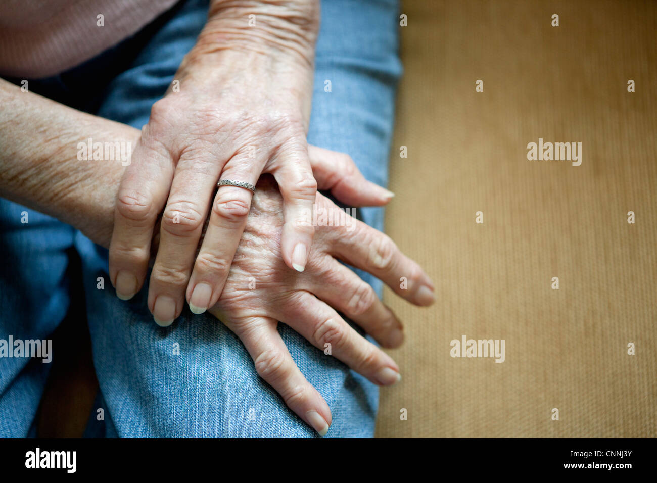 Elderly women with folded hands hi-res stock photography and images - Alamy