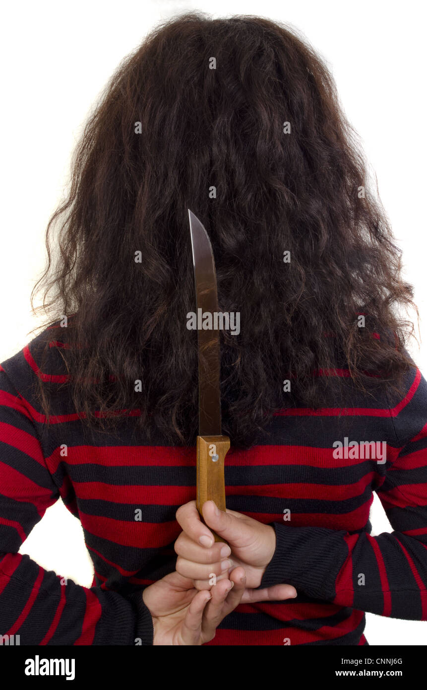 young woman holding a large knife behind her back Stock Photo - Alamy
