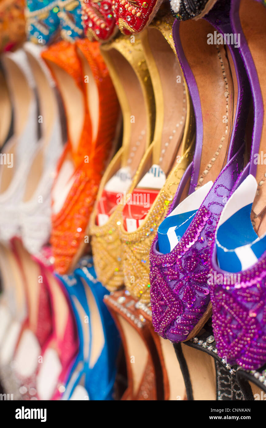 Fancy traditional Arabian slippers on display at a market stall in a ...