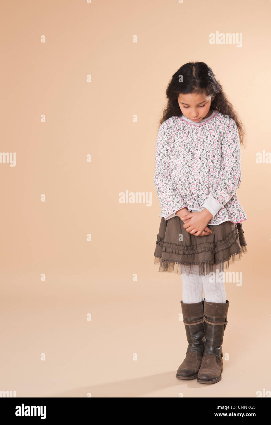 Girl with Head Down Stock Photo - Alamy