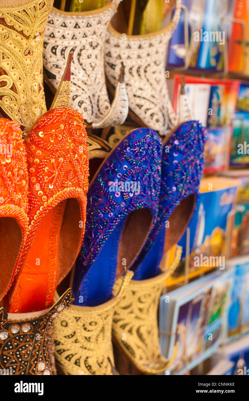 Fancy traditional Arabian slippers on display at a market stall in a ...
