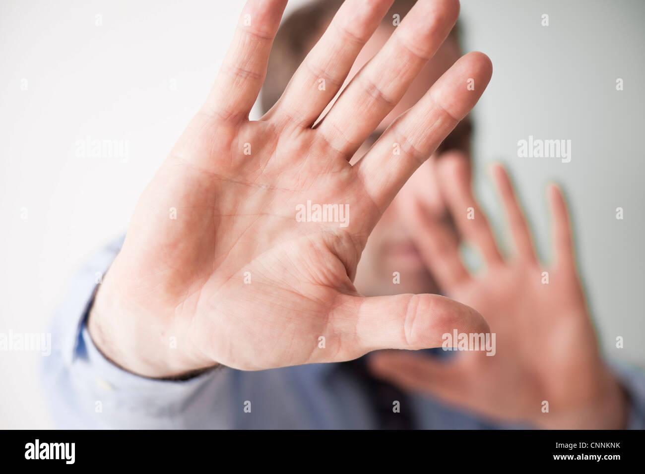 Businessman Blocking with Hands Stock Photo - Alamy