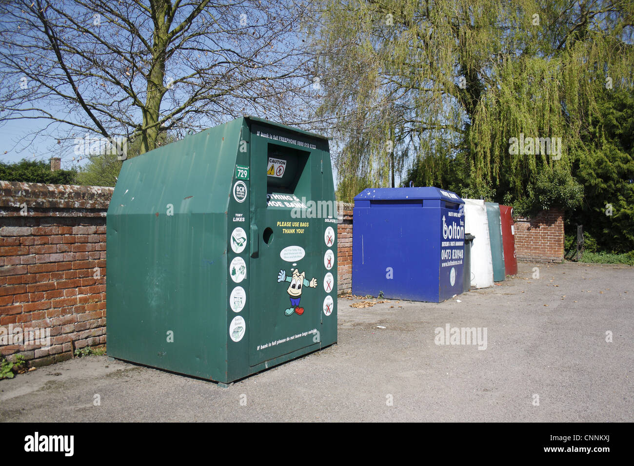 Recycling banks for clothing, paper and glass, in carpark of village ...