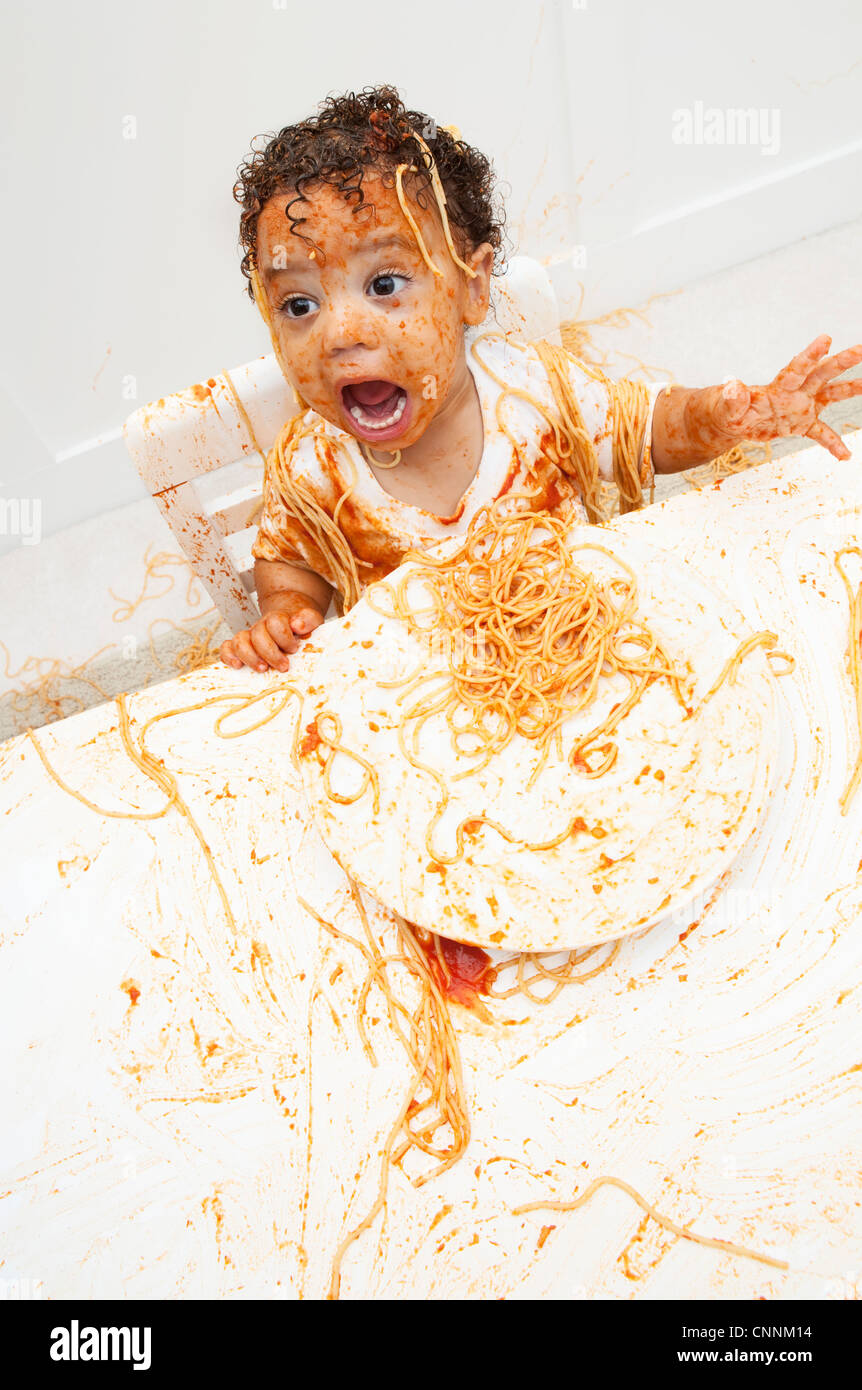 Boy eating Spaghetti with Hands Stock Photo - Alamy