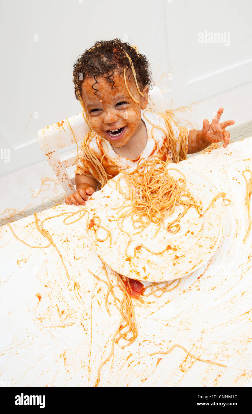 Boy eating Spaghetti with Hands Stock Photo - Alamy