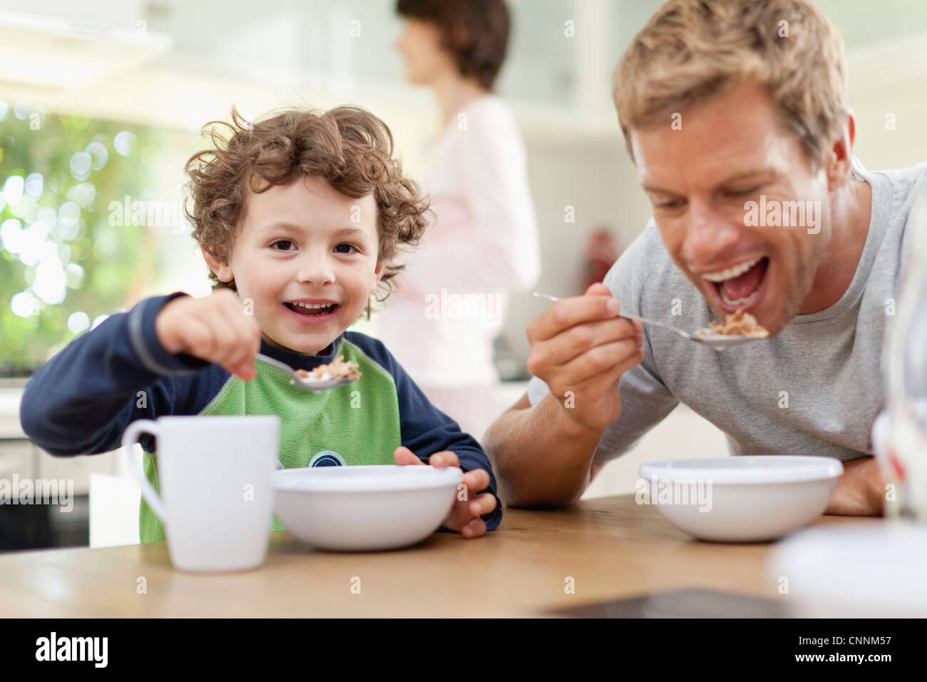 Father and son eating breakfast Stock Photo - Alamy