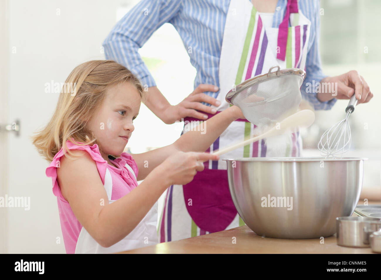 Mother and daughter baking in kitchen Stock Photo - Alamy