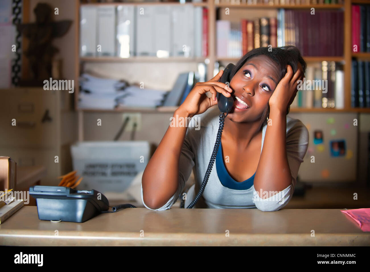 Young attractive black girl having private phone conversation while ...