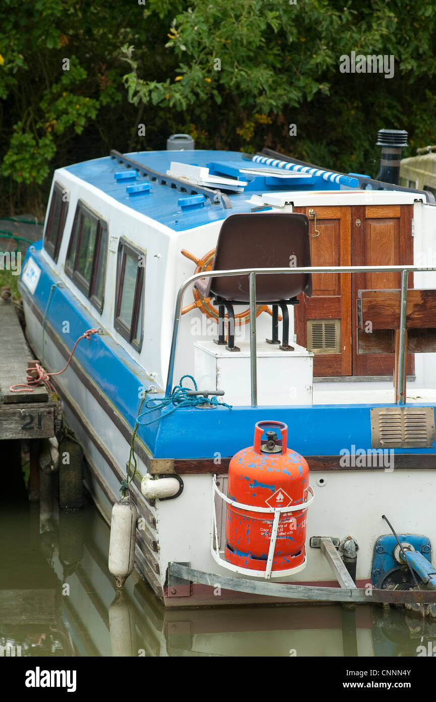 Boat moored in a marina carrying bottles of propane gas Stock Photo - Alamy