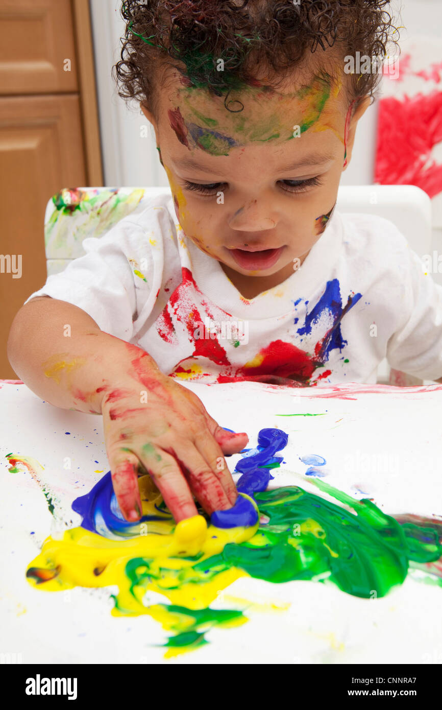 messy toddler fingerpainting Stock Photo - Alamy