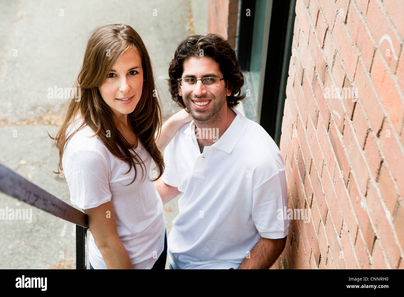 Close-up Portrait of Young Couple Standing on Fire Escape Stock Photo ...
