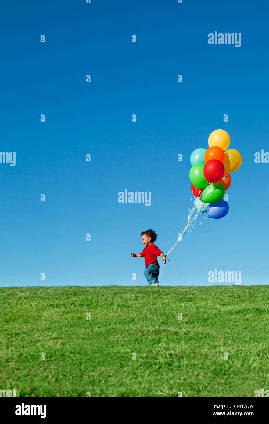 Boy with Balloons Stock Photo - Alamy
