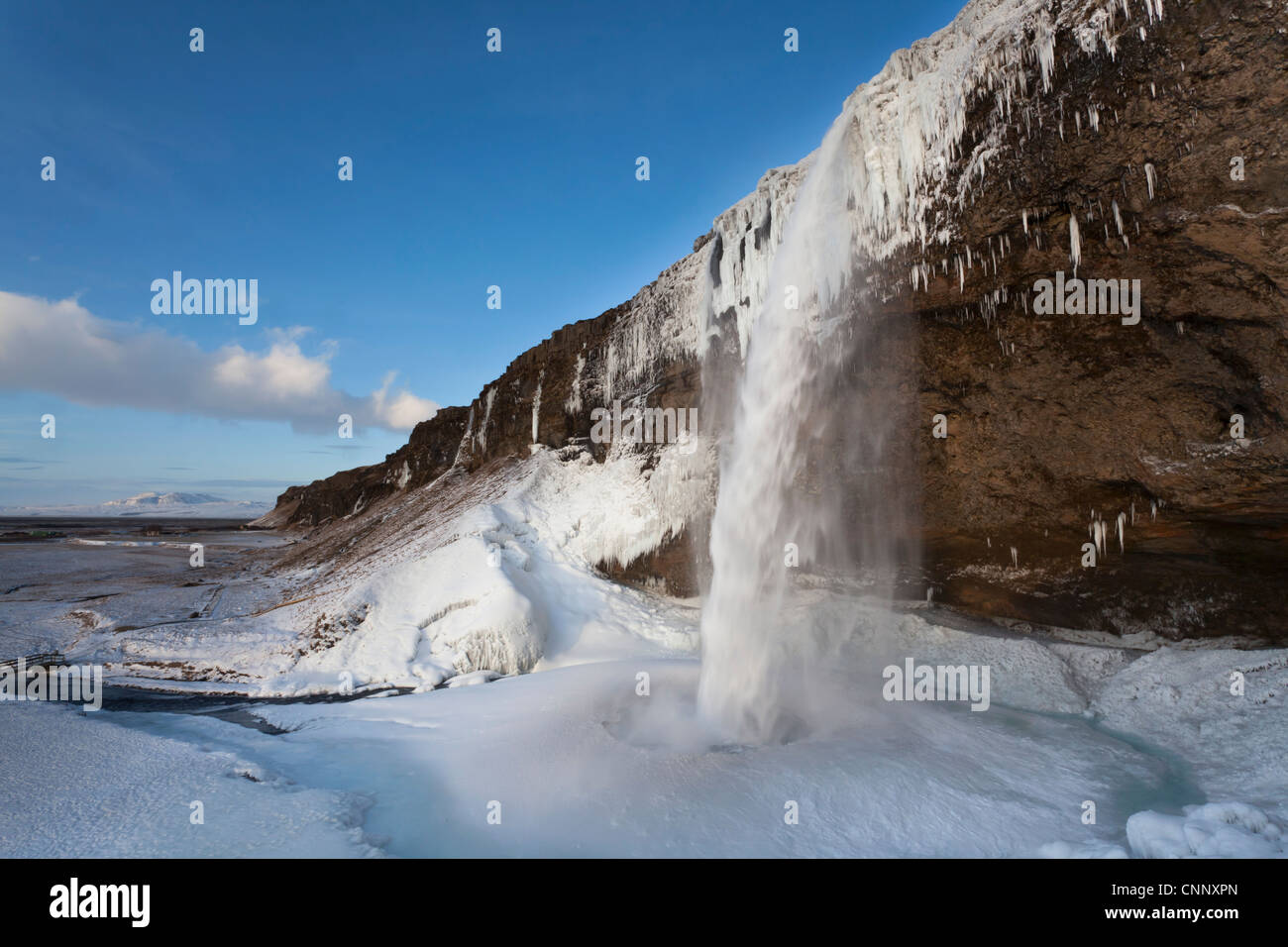 Glacial waterfall pouring into ice Stock Photo - Alamy