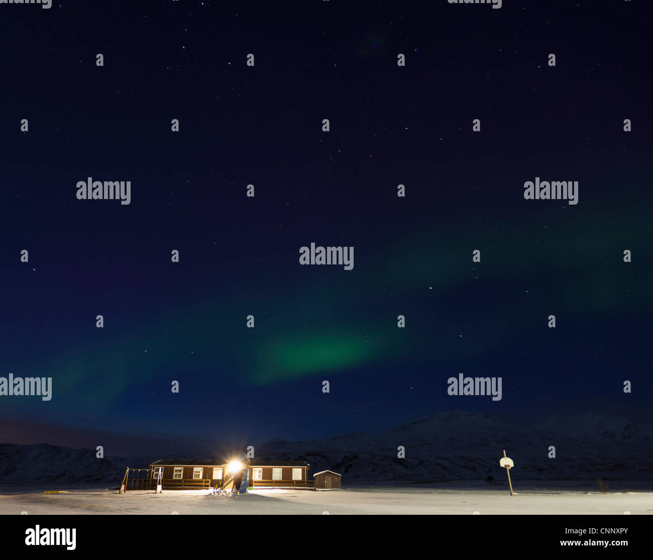 Lit building in snowy field Stock Photo - Alamy