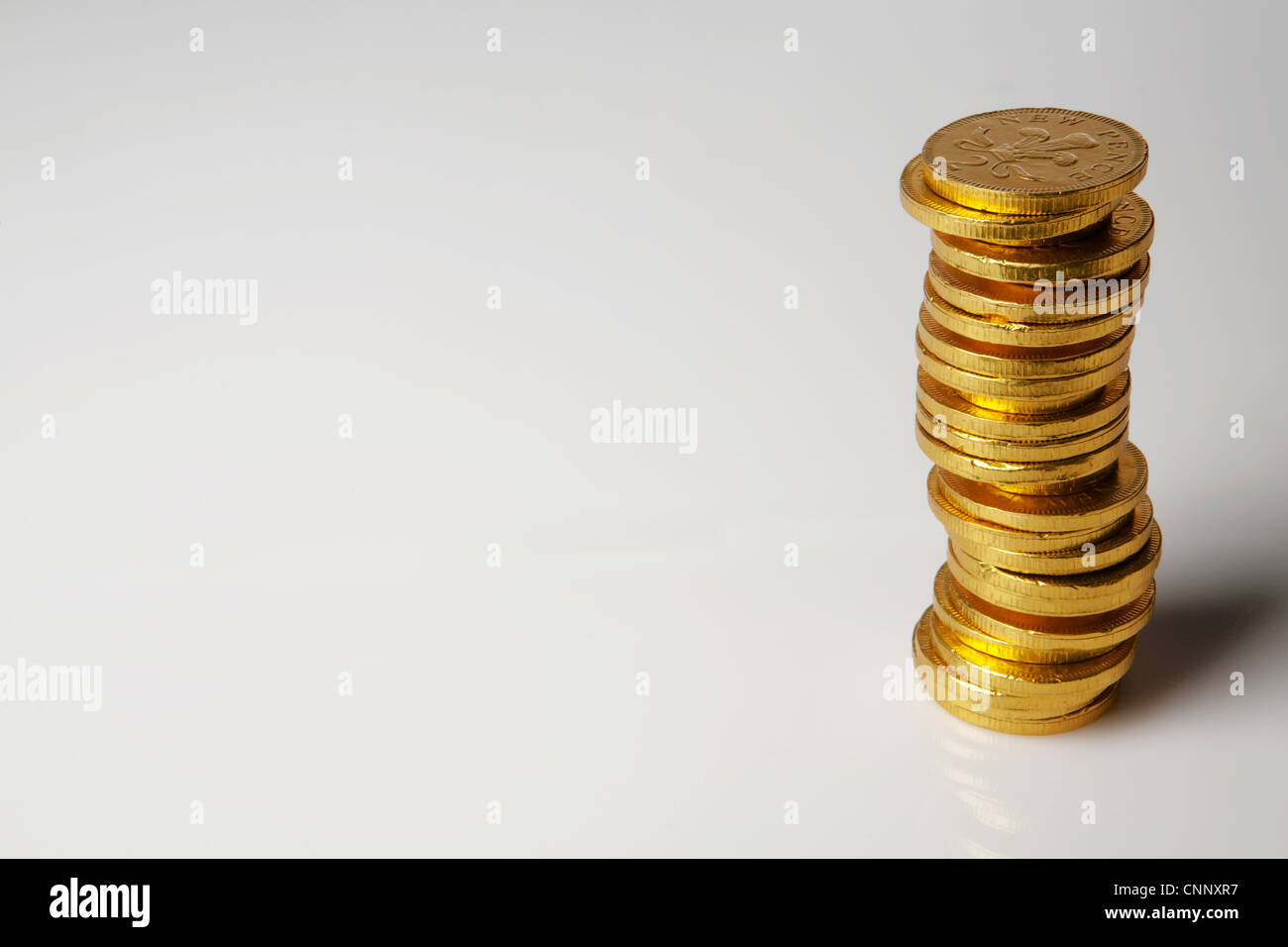 chocolate money coins on white background Stock Photo - Alamy
