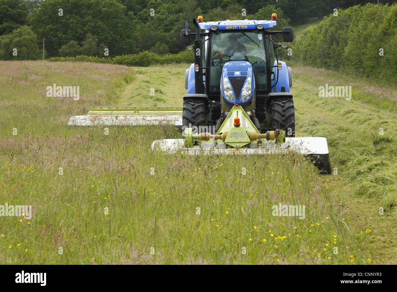Contractor New Holland T6080 tractor front rear mounted Claas mowers ...