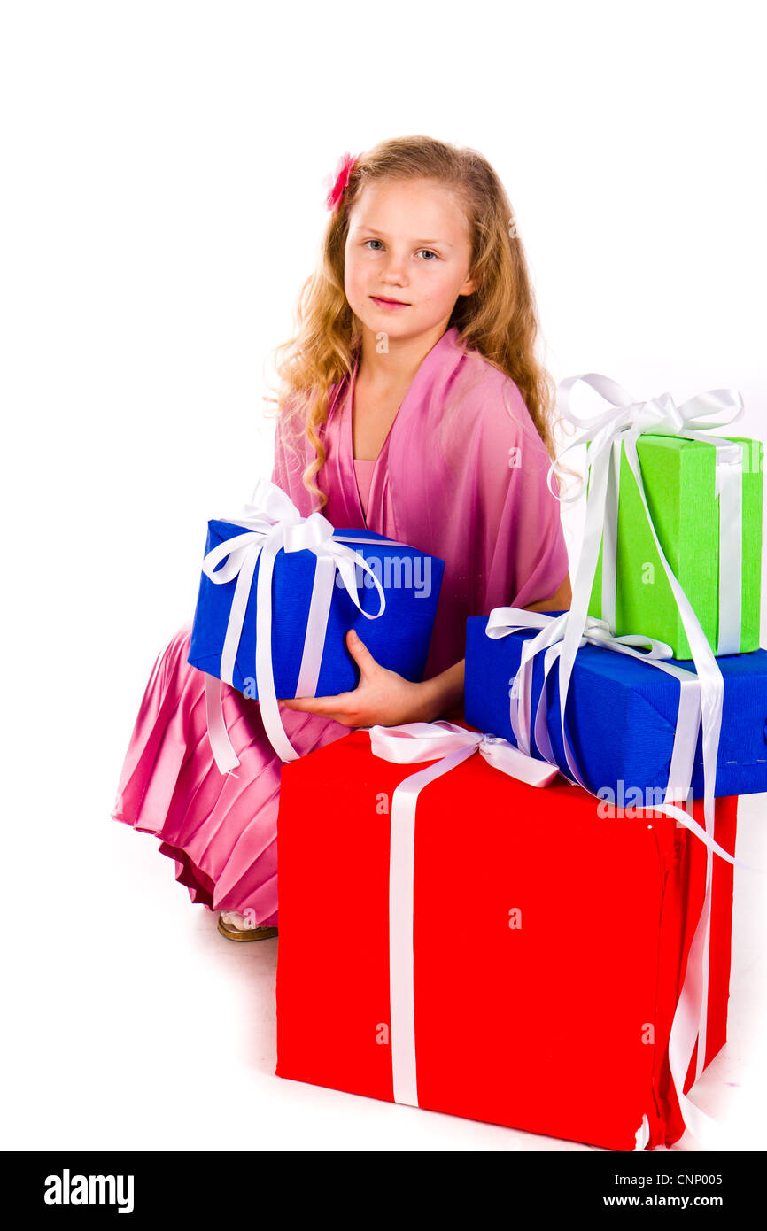 Little girl with gift boxes isolated on white Stock Photo - Alamy