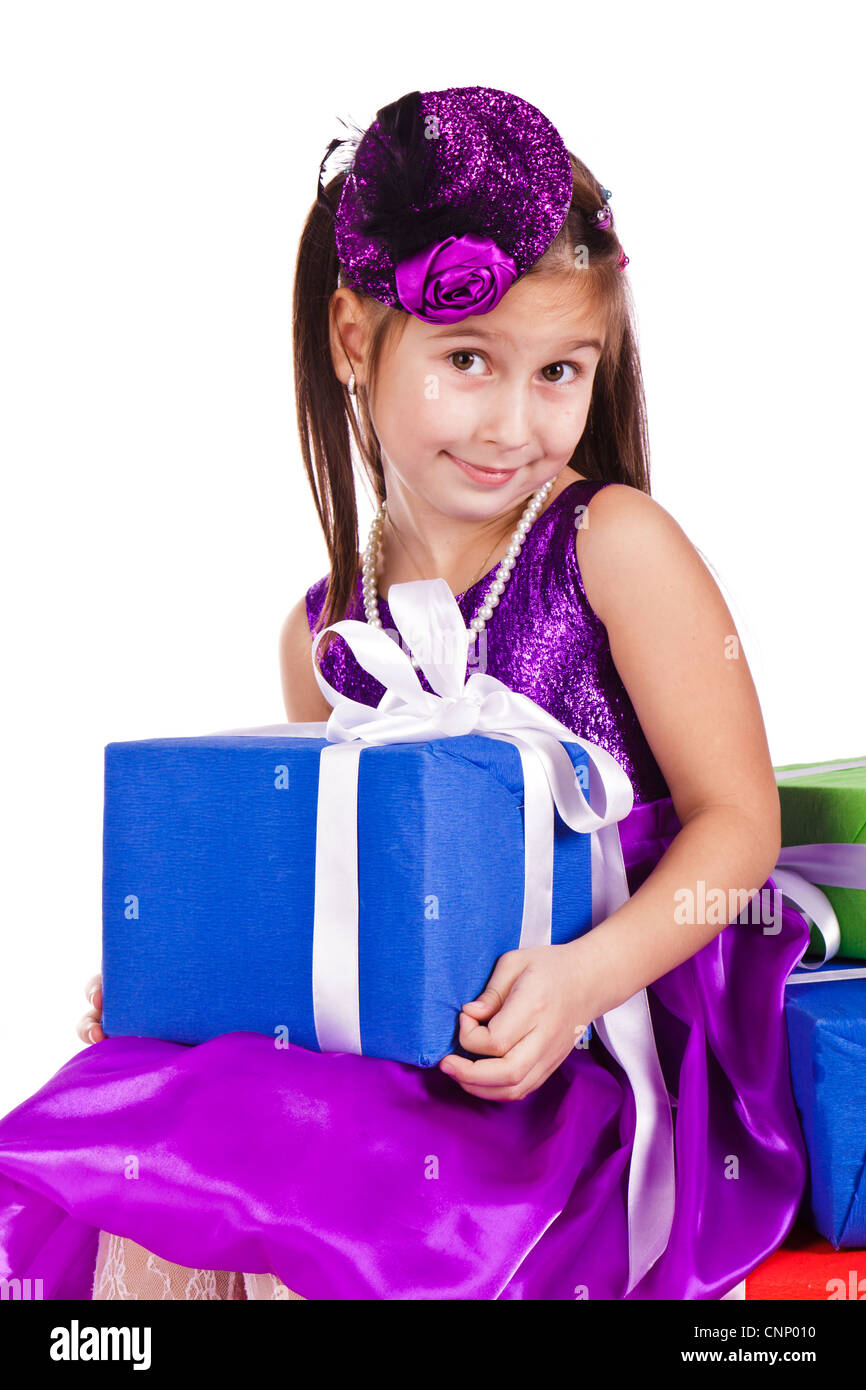 Beautiful little girl with presents over white background Stock Photo ...