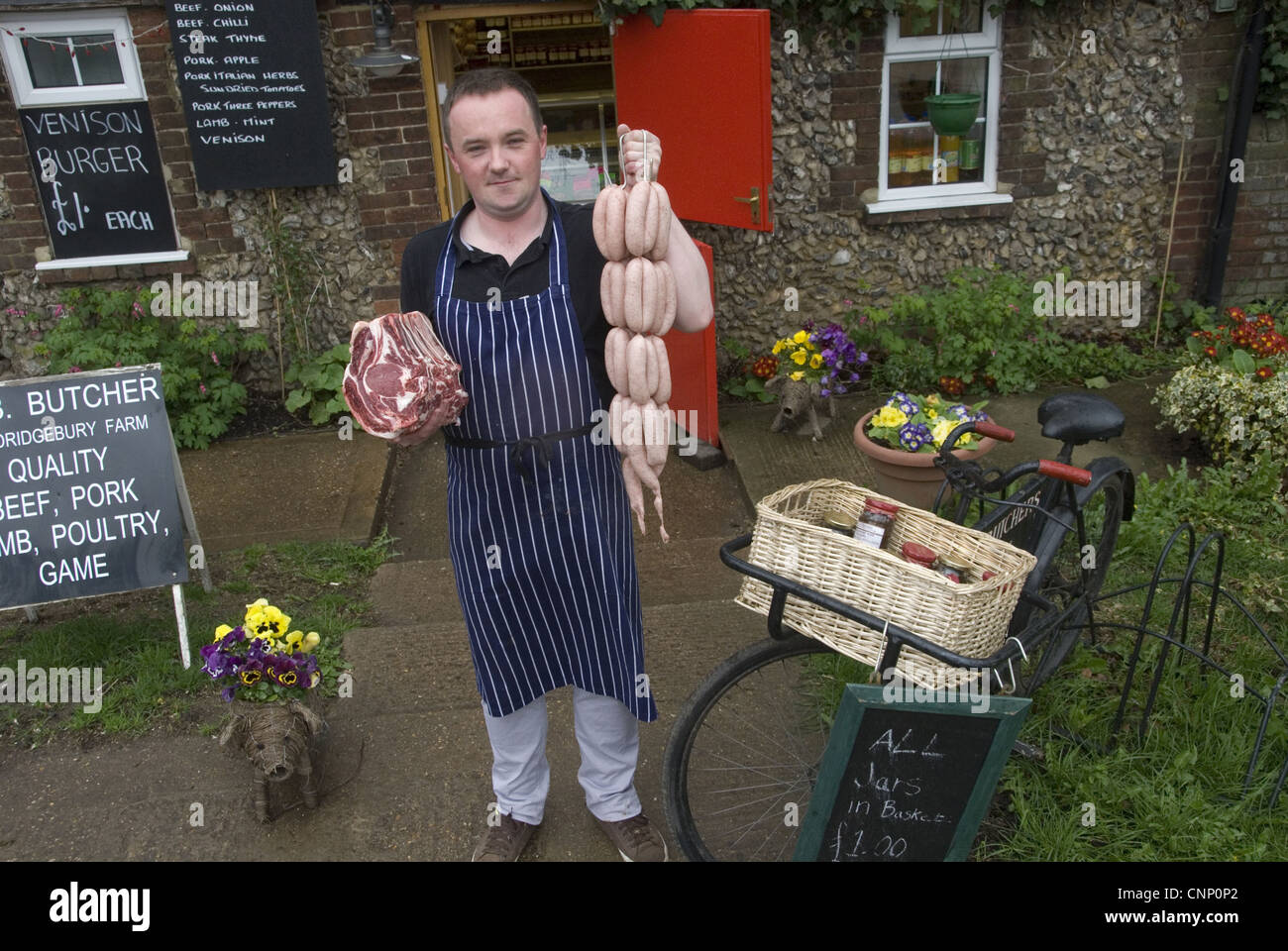 Traditional village butcher outside shop, Sandridgebury, Hertfordshire ...