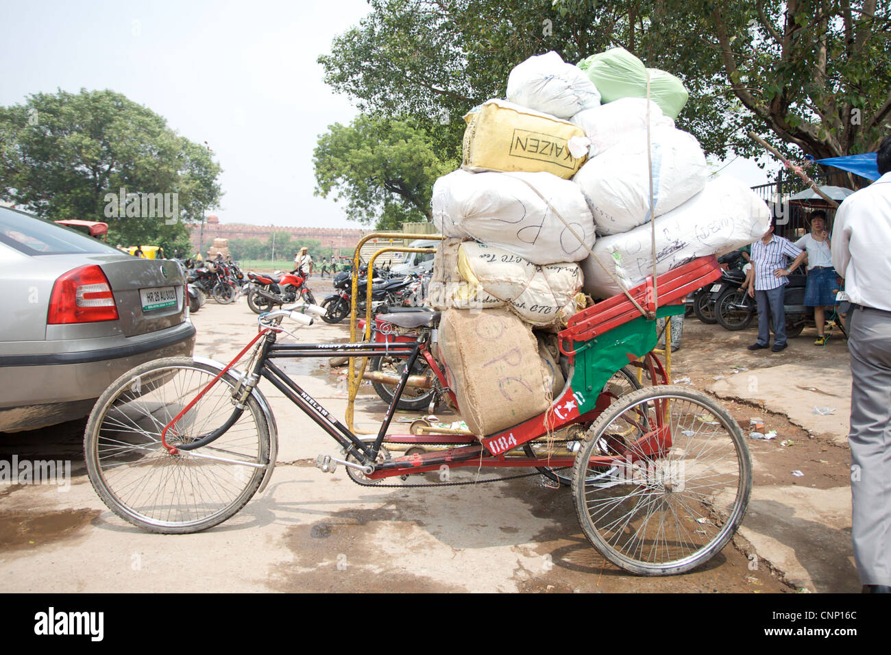 A rickshaw loaded with goods to be sold at the market in Old Delhi ...