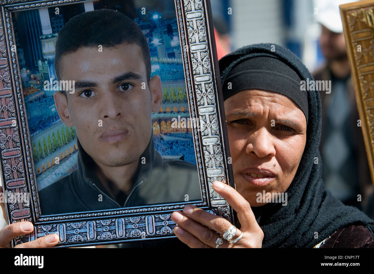 Tunisia, Tunis: Women and men mourning their sons who died during the ...