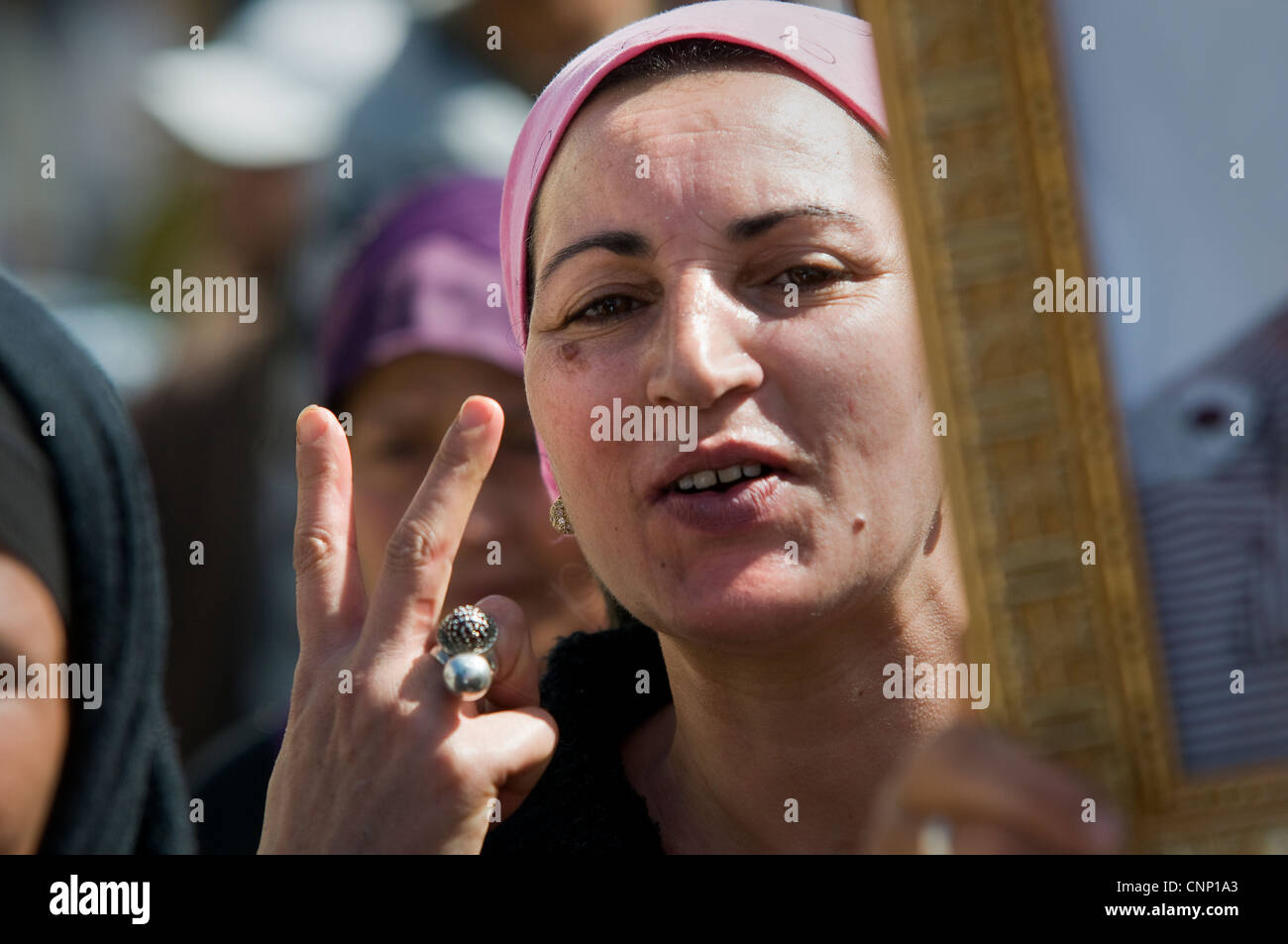 Tunisia, Tunis: Women and men mourning their sons who died during the ...