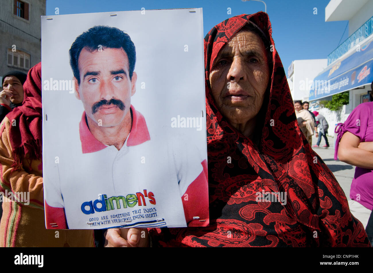 Tunisia, Tunis: Women and men mourning their sons who died during the ...