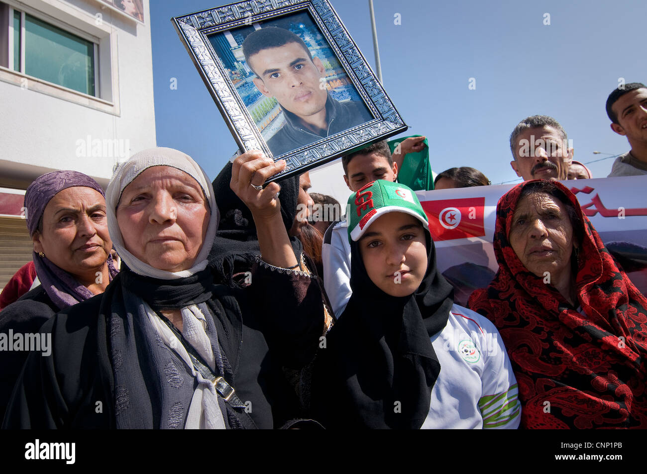 Tunisia, Tunis: Women and men mourning their sons who died during the ...