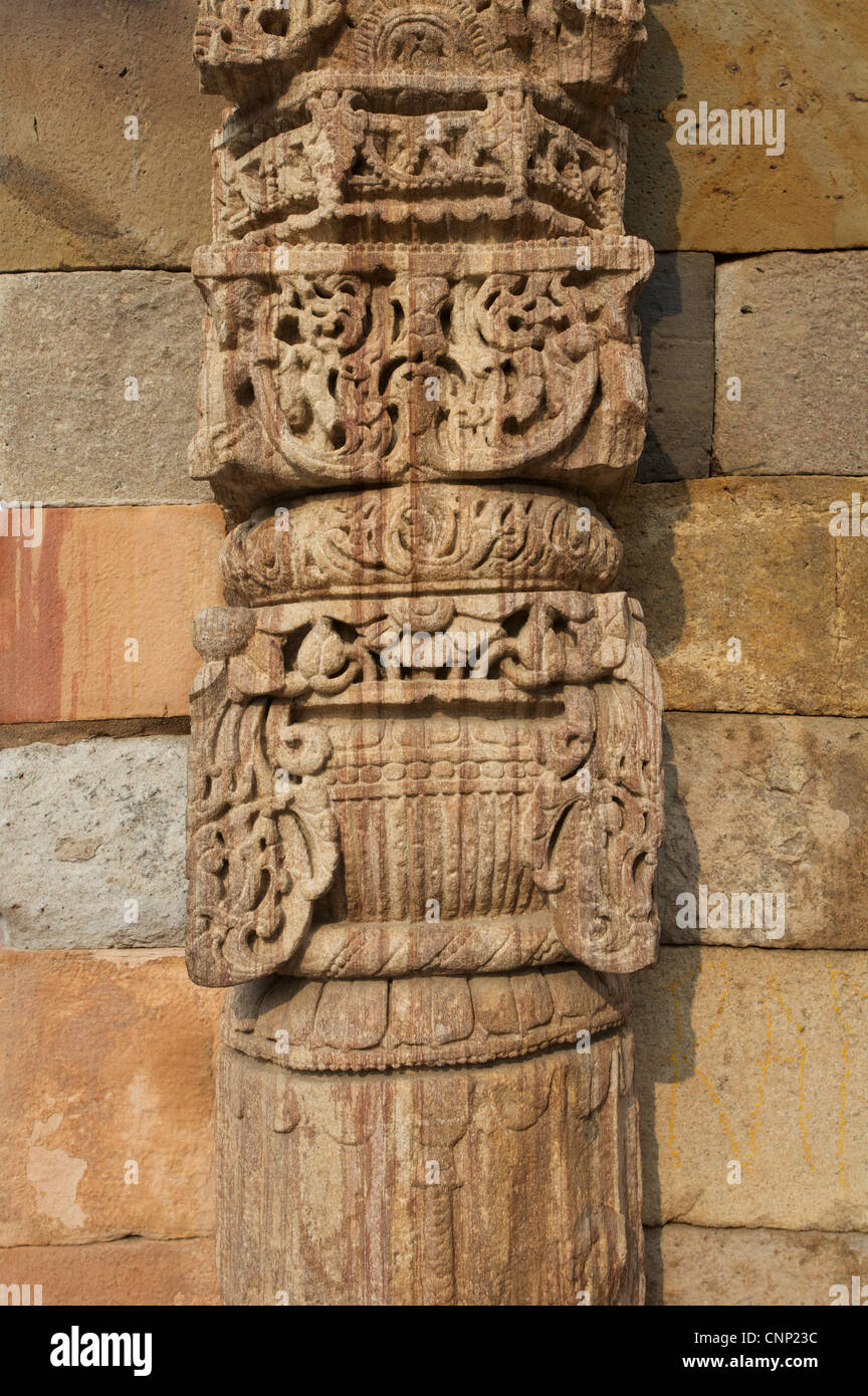 Decorative stone columns in the gardens of the Quitab Minar Tower, New ...
