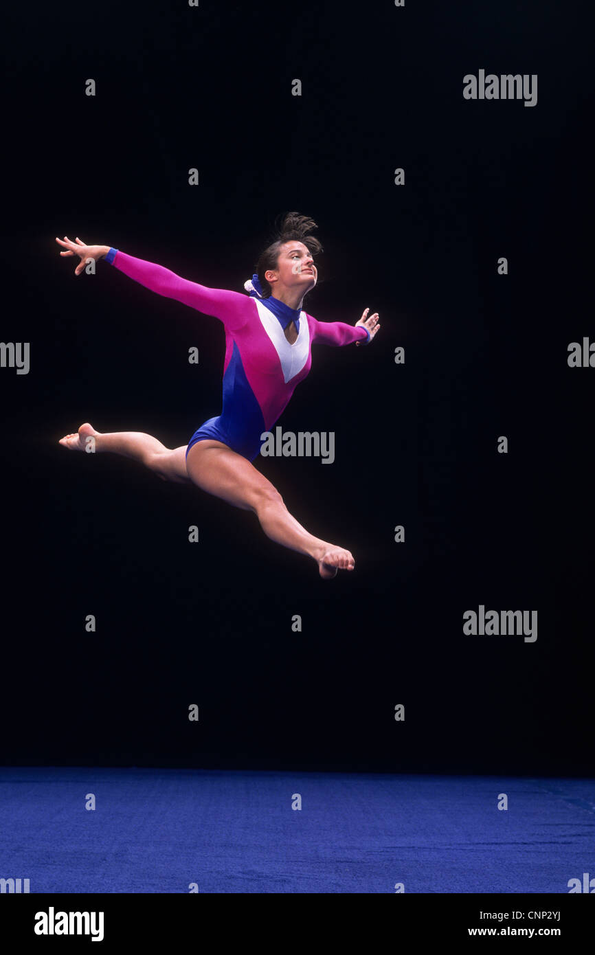 Female gymnast on the floor exercise Stock Photo - Alamy