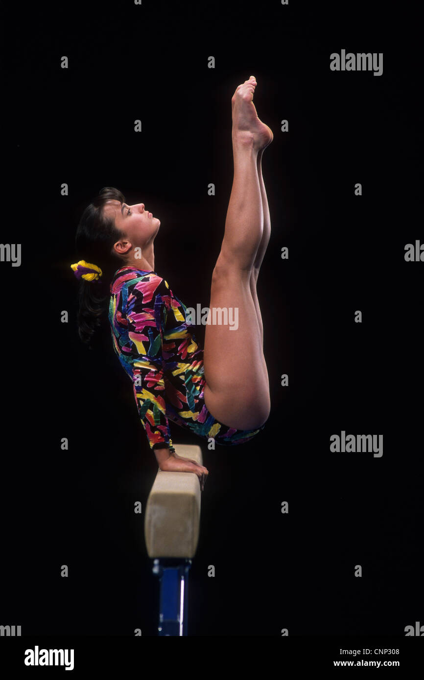 Female gymnast on the balance beam Stock Photo - Alamy