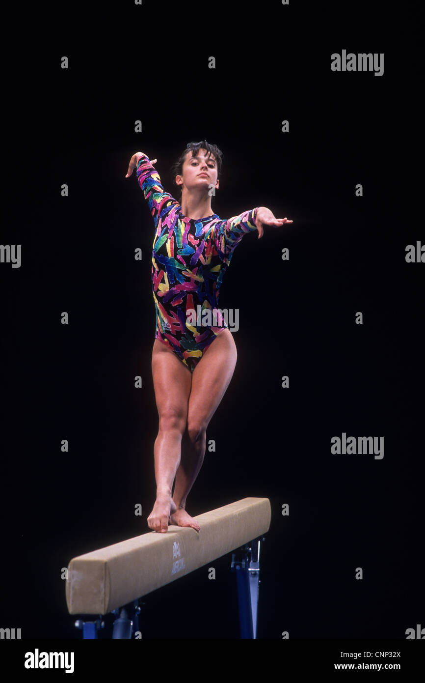 Female gymnast on the balance beam Stock Photo - Alamy