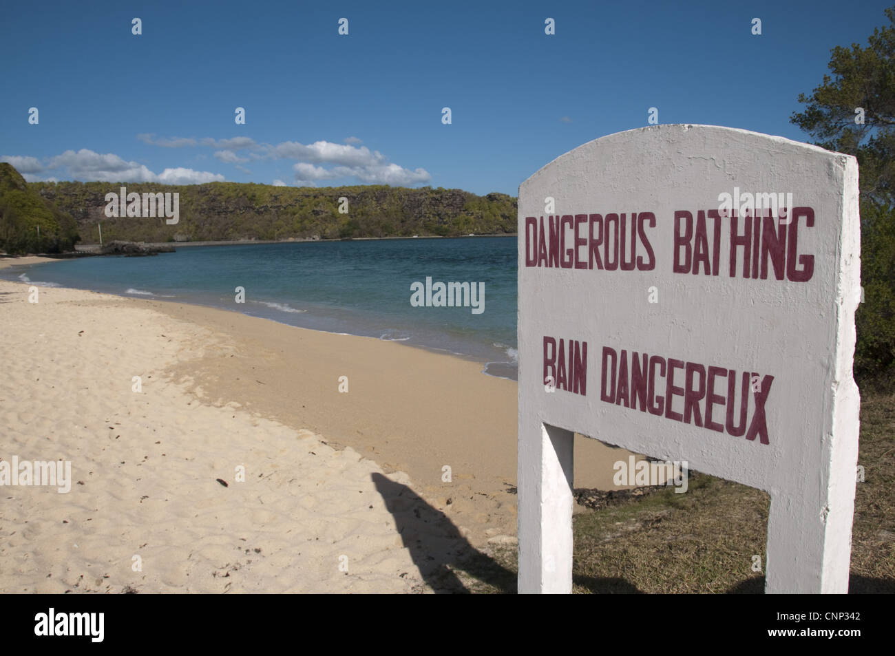 'Dangerous Bathing, Bain Dangereux' bilingual sign on sandy beach ...