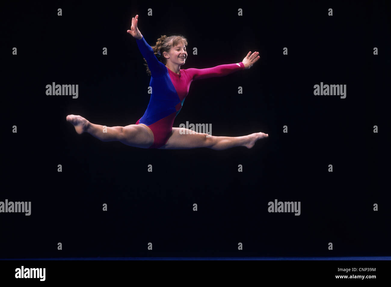 Female gymnast on the floor exercise Stock Photo - Alamy