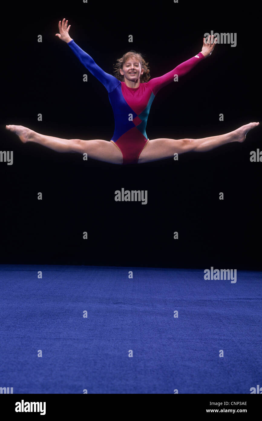 Female gymnast on the floor exercise Stock Photo - Alamy