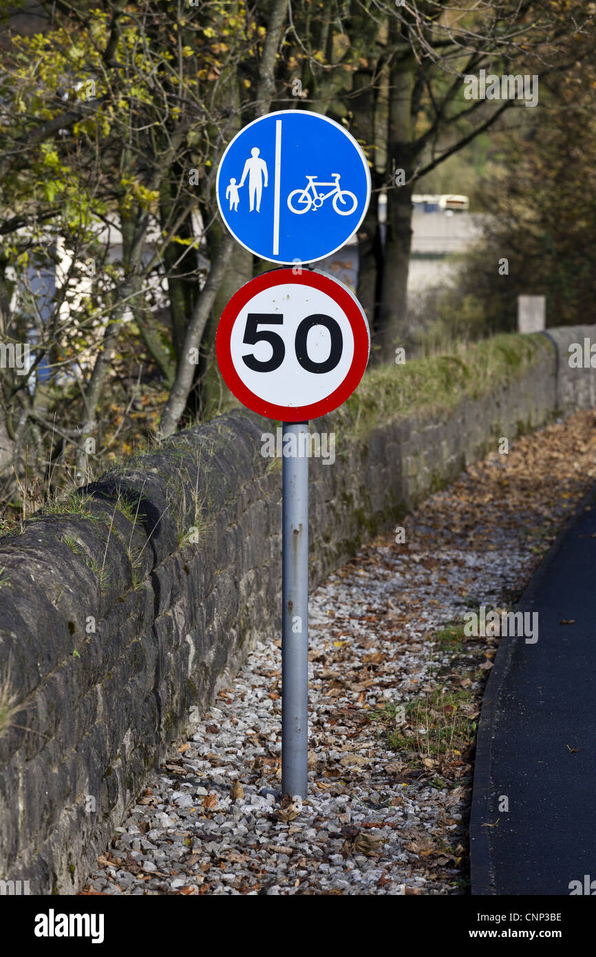 Footpath, cycle lane and 50mph speed limit roadside signs, England ...