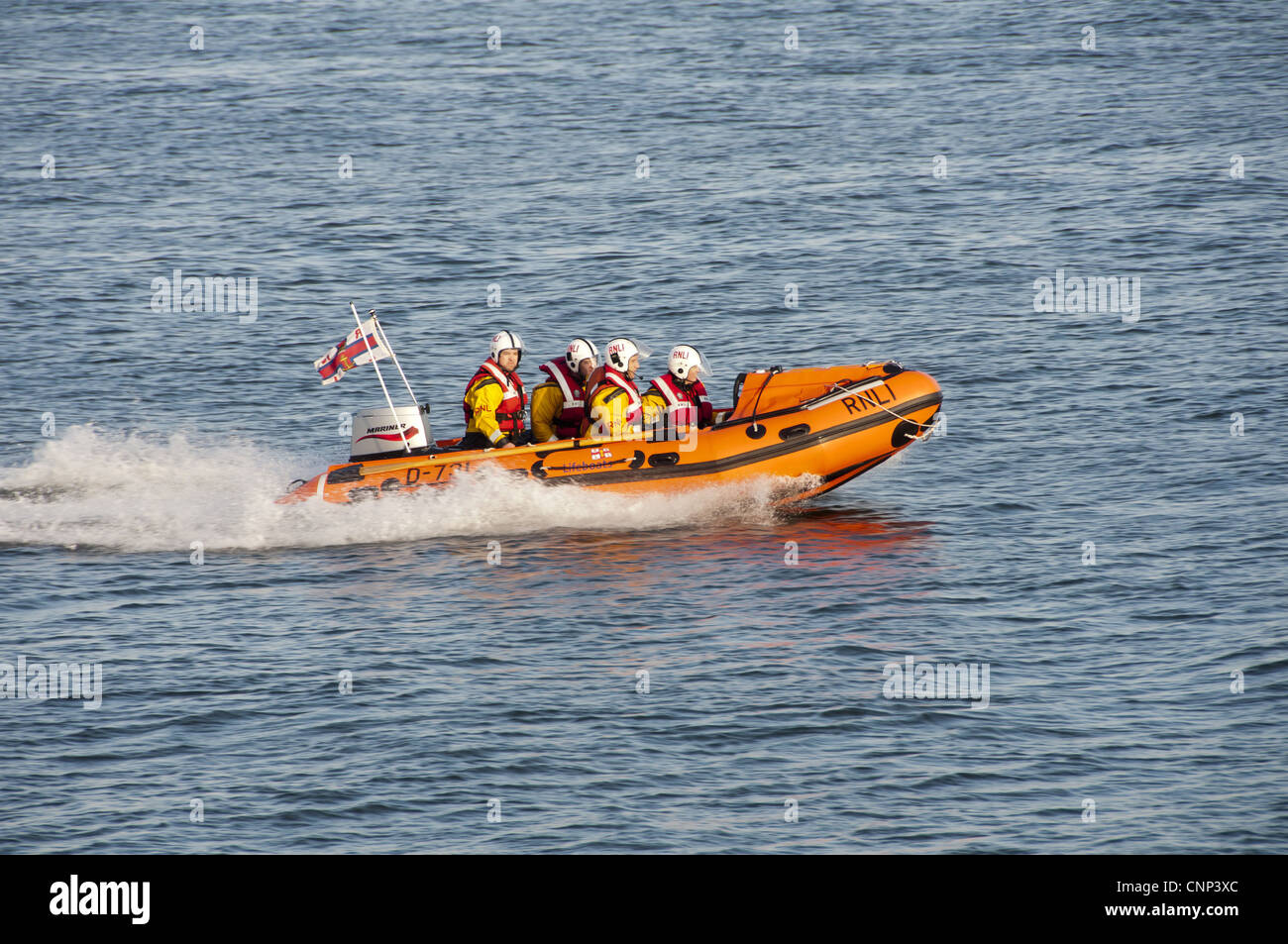 RNLI D-class inflatable lifeboat in harbour entrance, Dublin Port ...